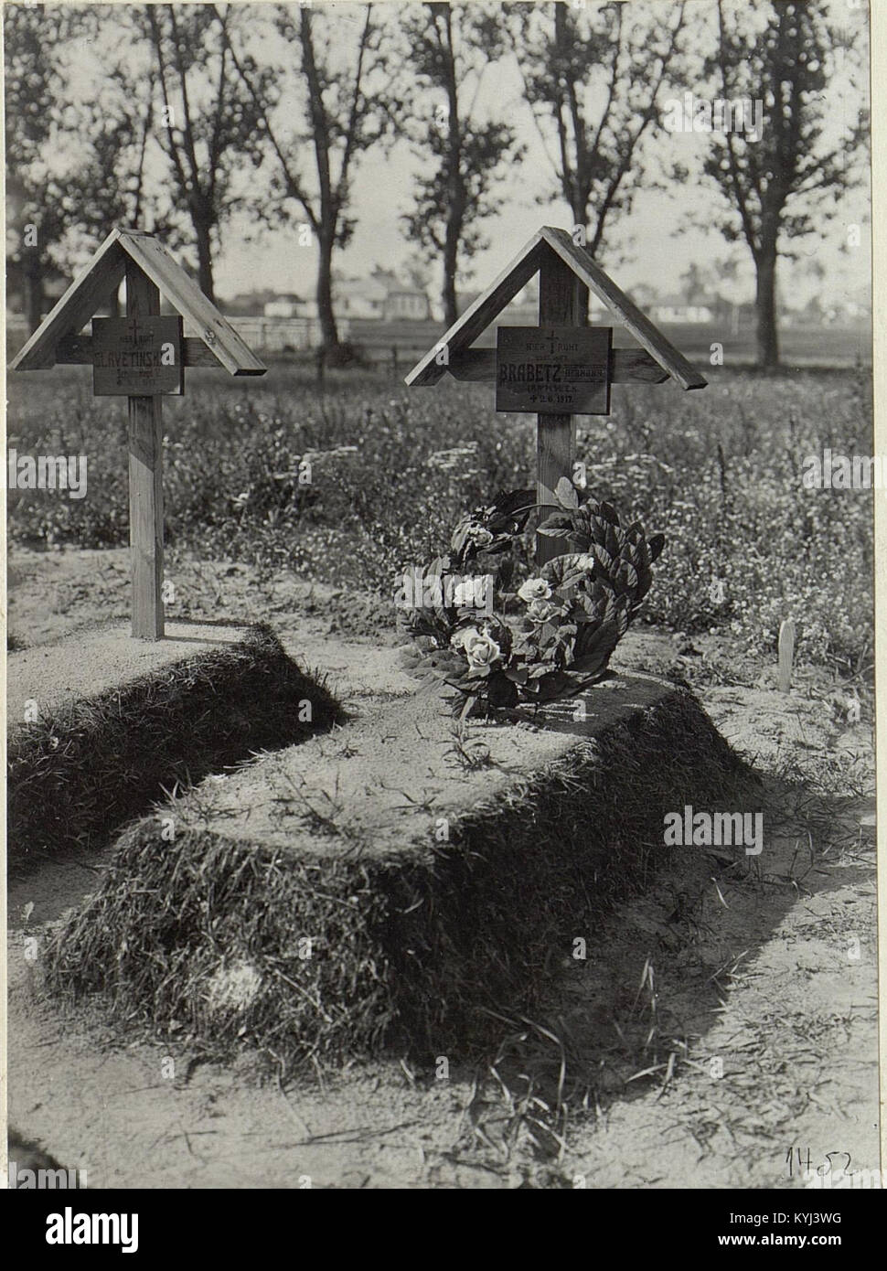 The photograph shows soldiers’ cemeteries, graves, and monuments on a ...