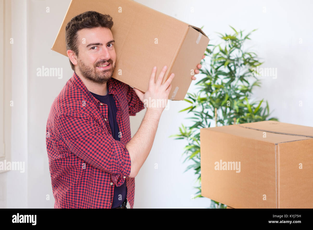 Attractive package delivery man hi-res stock photography and images - Alamy