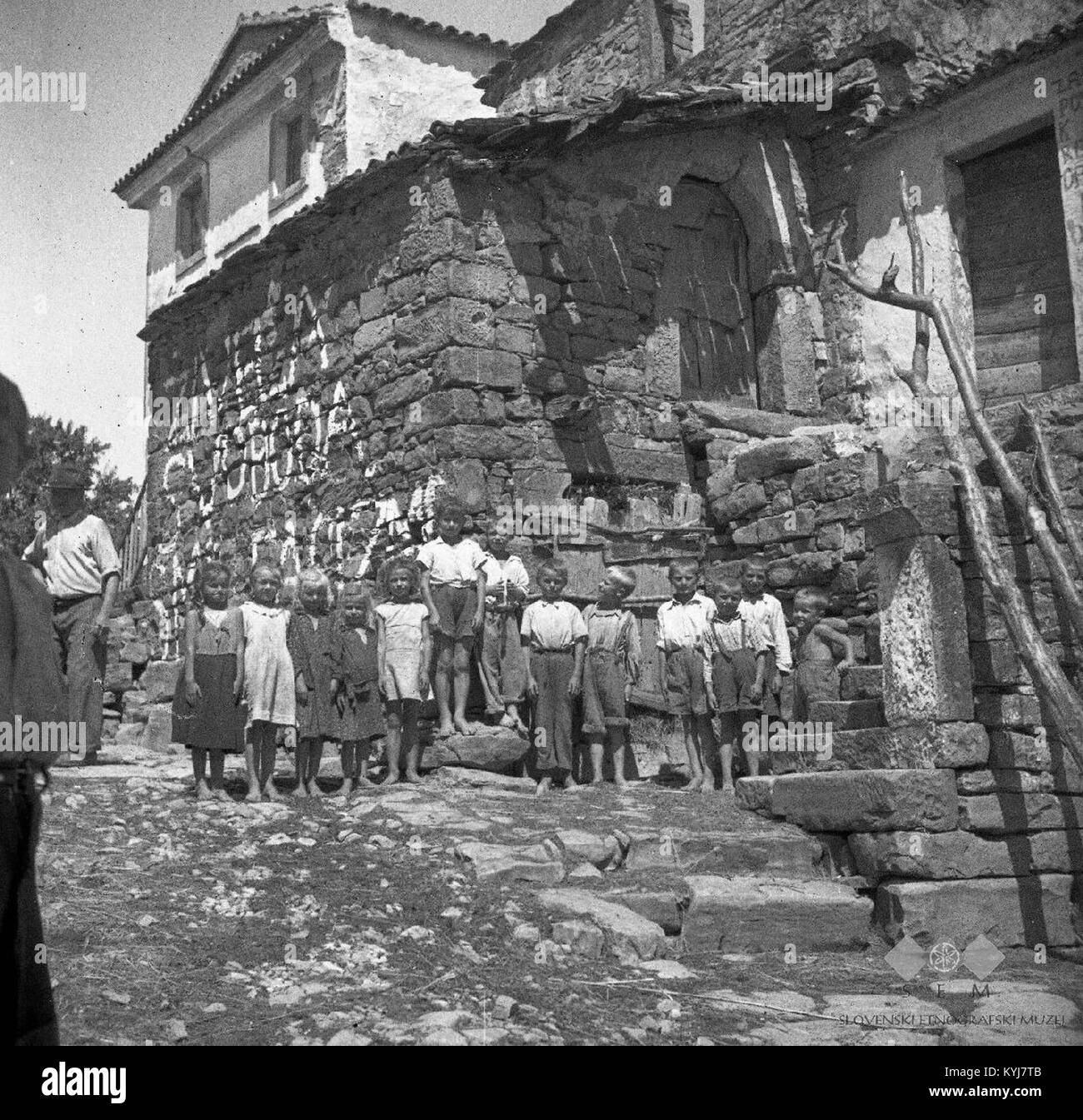 A 1950 photograph shows a decaying Slovenian hay barn with a vaulted ...