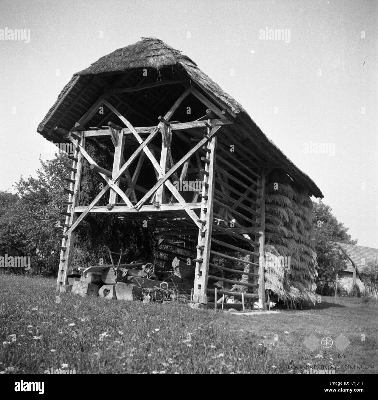 This image from 1957 depicts a traditional Slovenian double hayrack ...