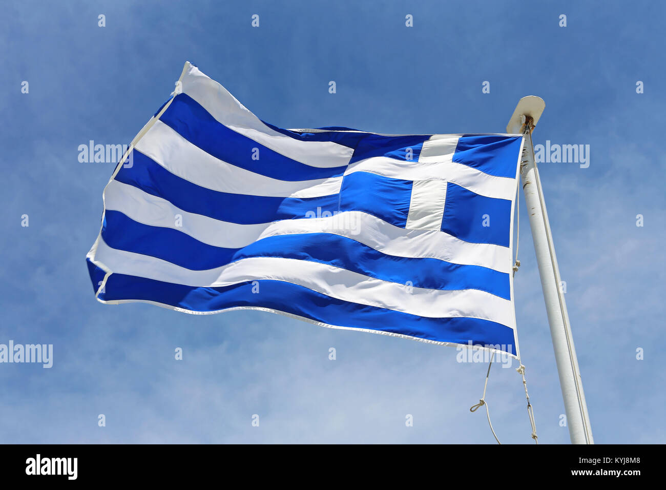 Flag of Greece Flying in Wind and Blue Sky Stock Photo - Alamy