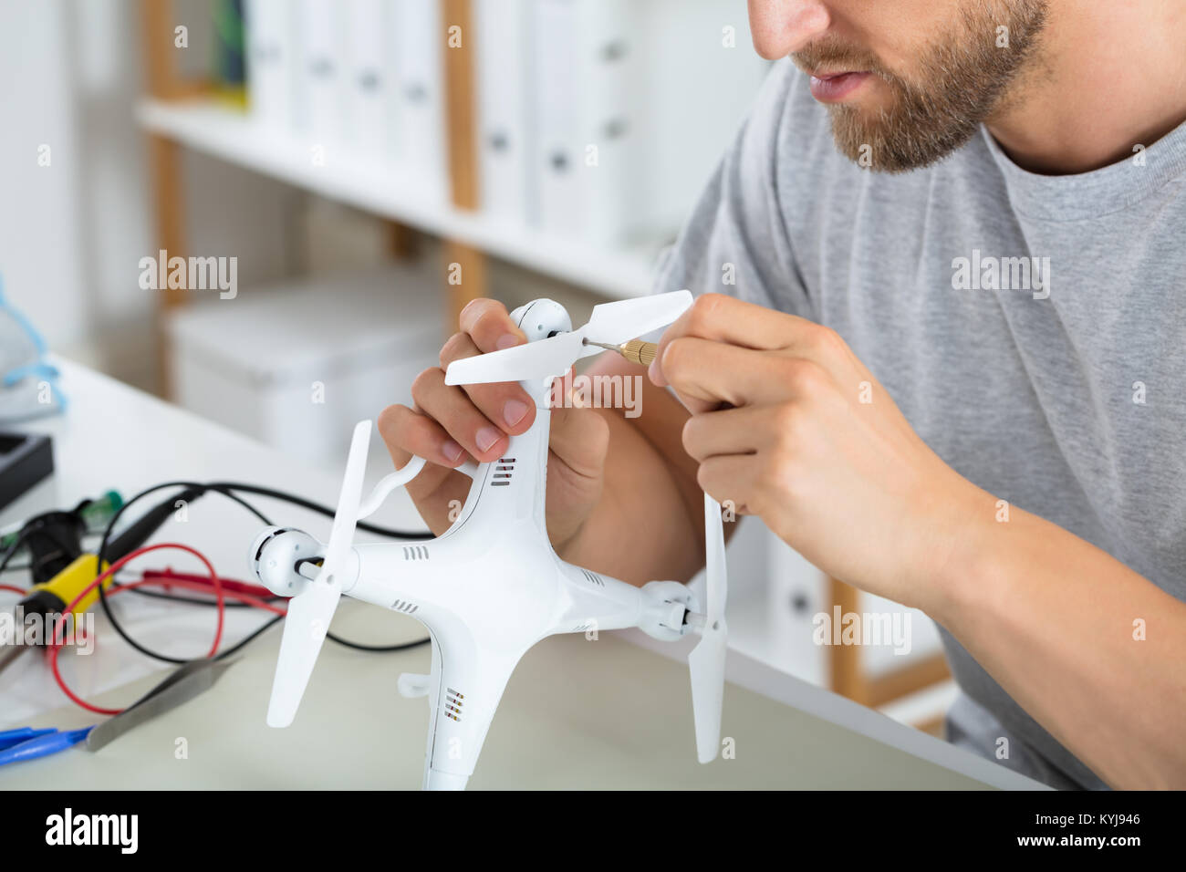 Close-up Of Male Hands Fixing Propeller Of Drone With Screw Driver At ...