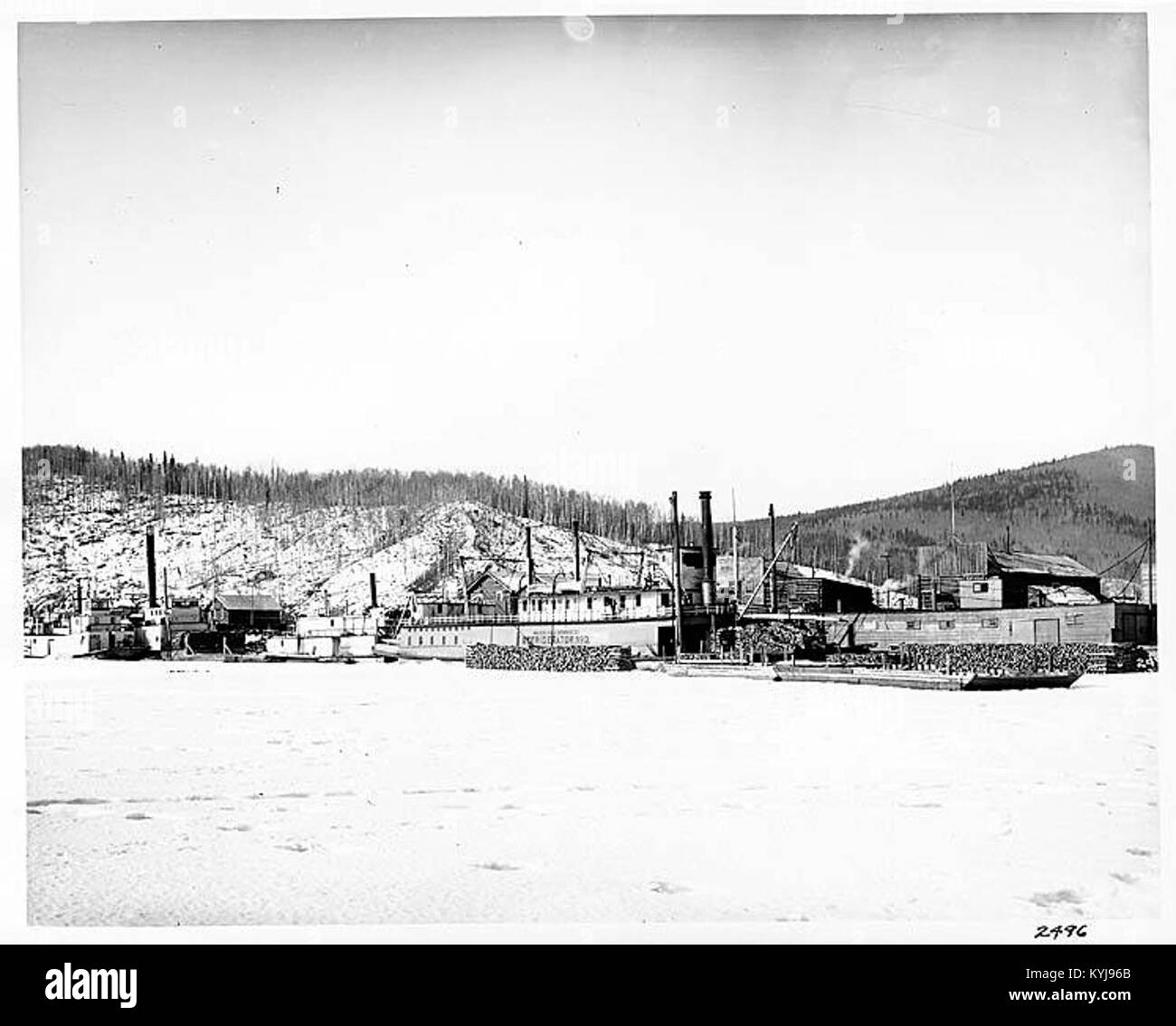 The stern wheel steamer ROBERT KERR is shown with barges at dock around ...