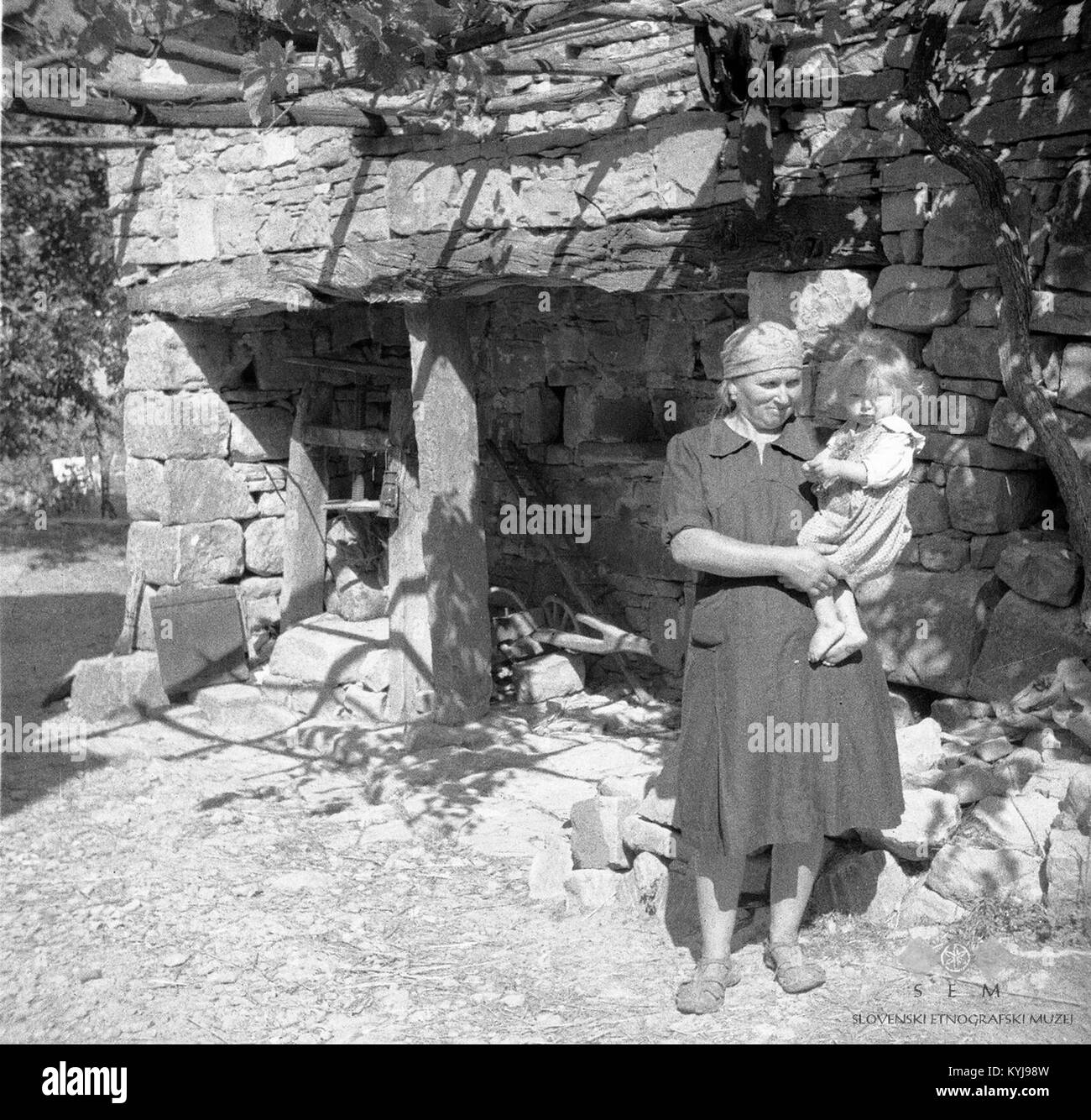 This 1950 photograph shows Ana Vergan with her child, representing a ...