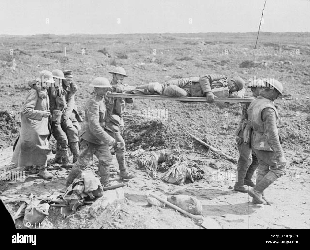 The photograph depicts stretcher bearers and German prisoners of war ...