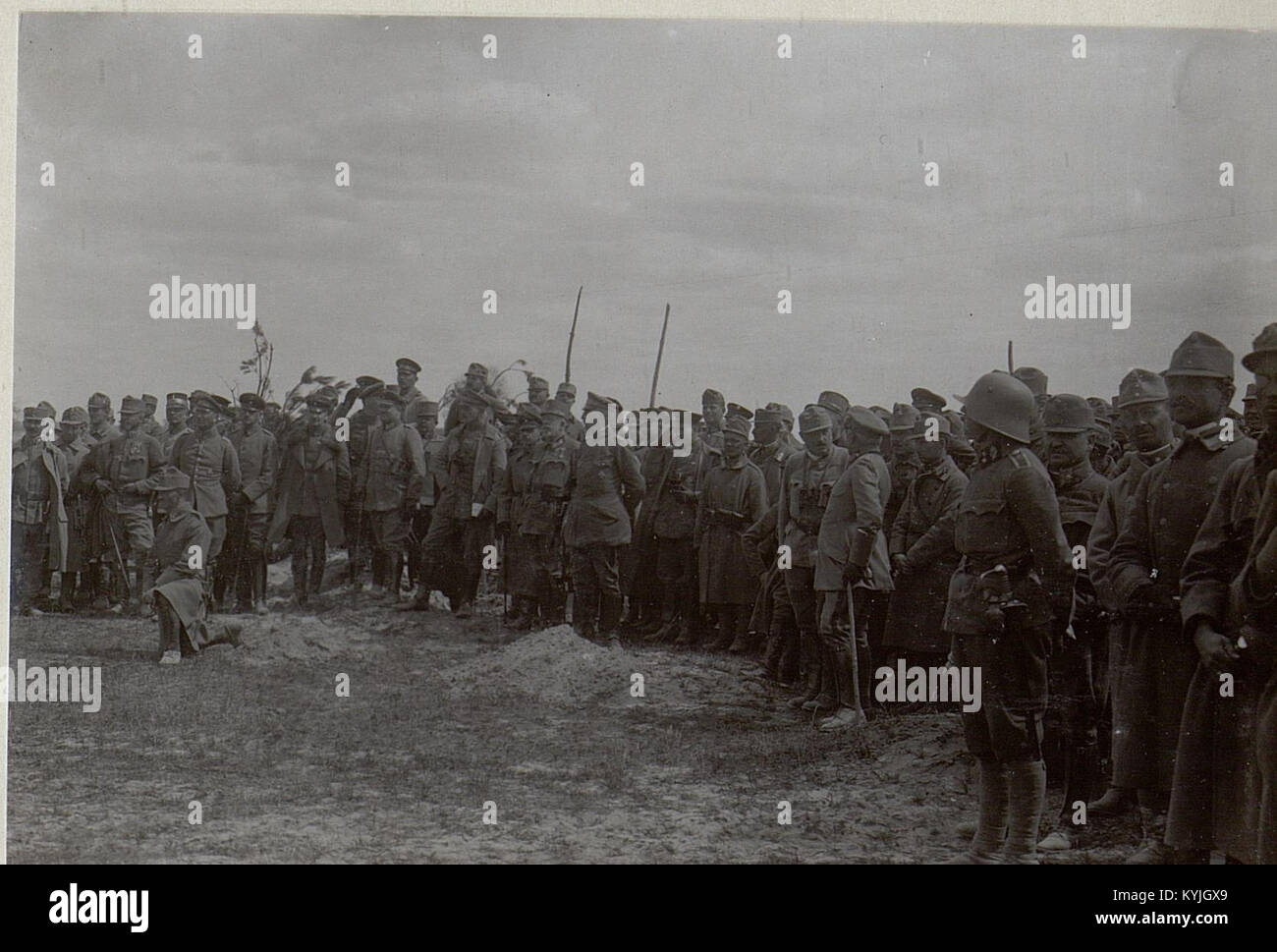 This photograph shows spectators observing a final military maneuvers ...