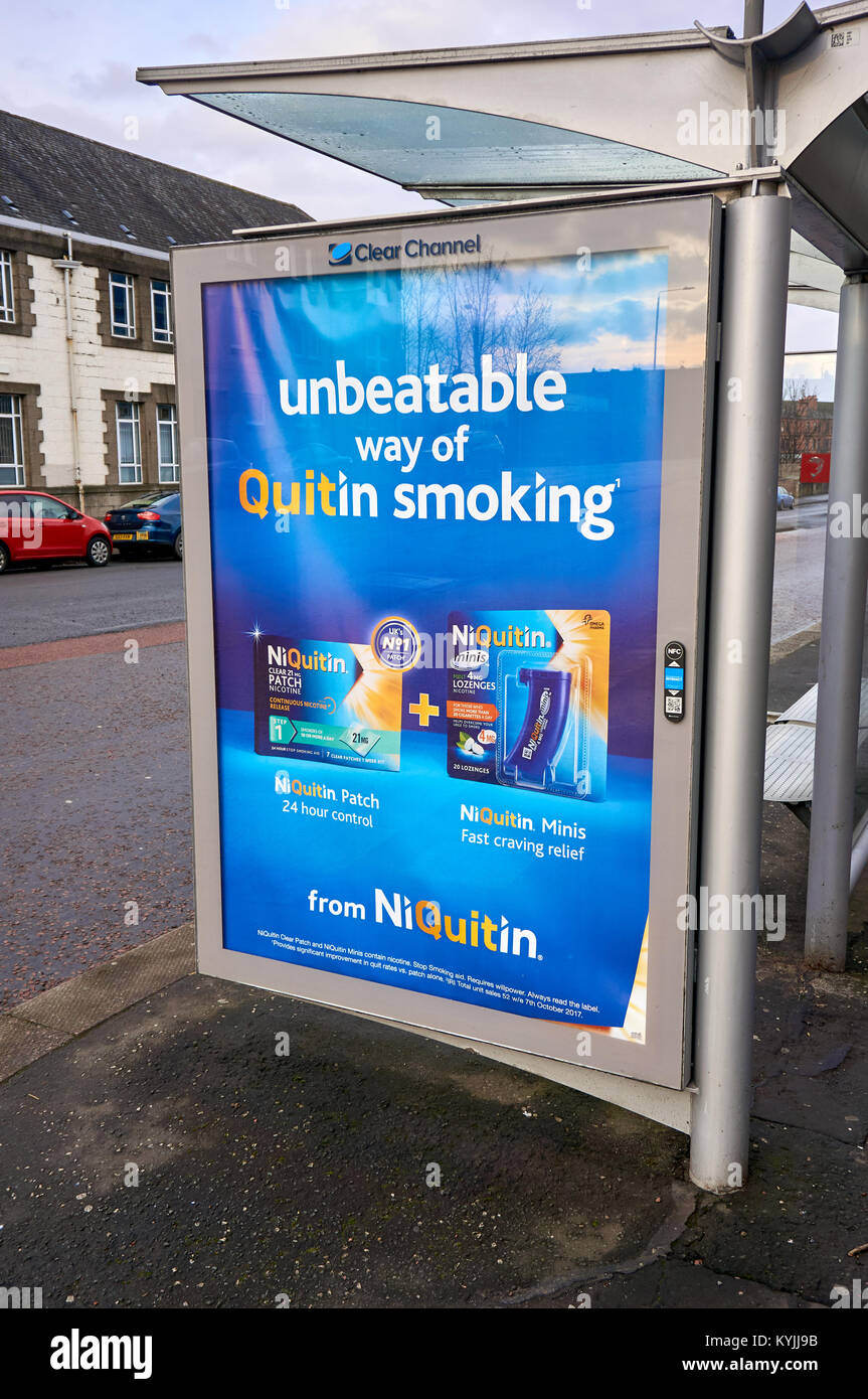 Advertisement of Niquitin on a typical bus stop in UK Stock Photo - Alamy