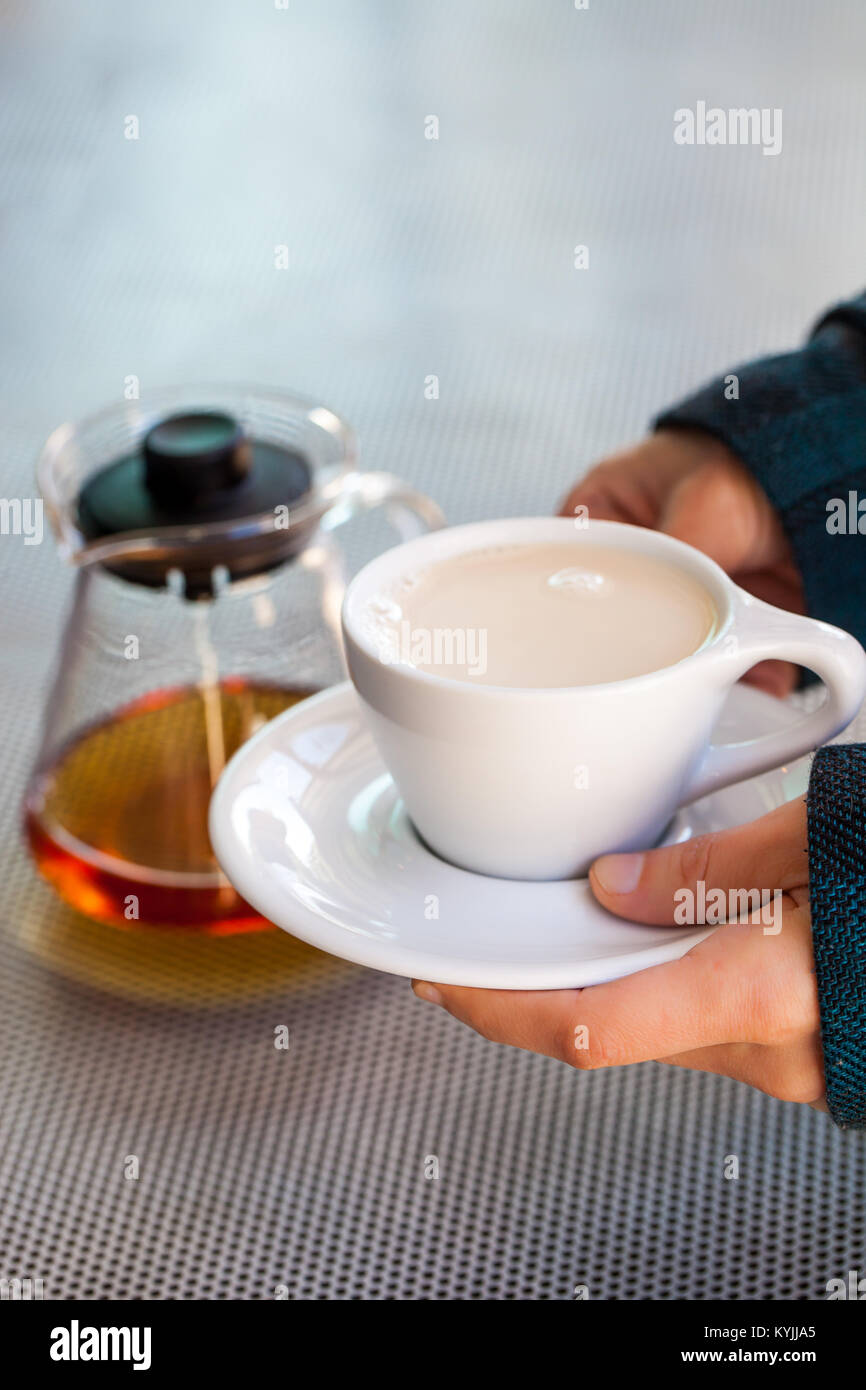 Teapot in hand hi-res stock photography and images - Alamy