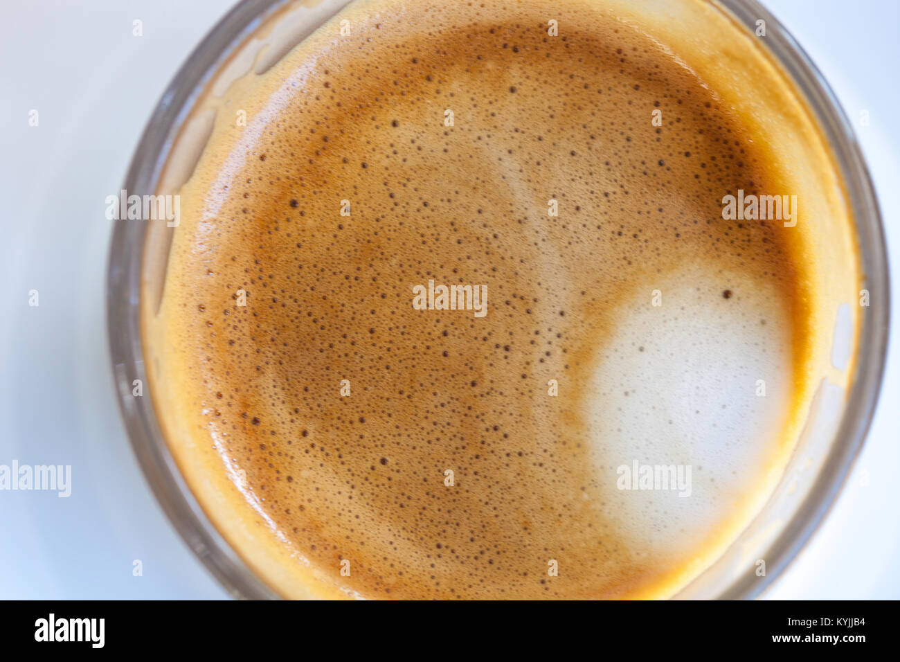 Close up top view cortado coffee froth Stock Photo - Alamy