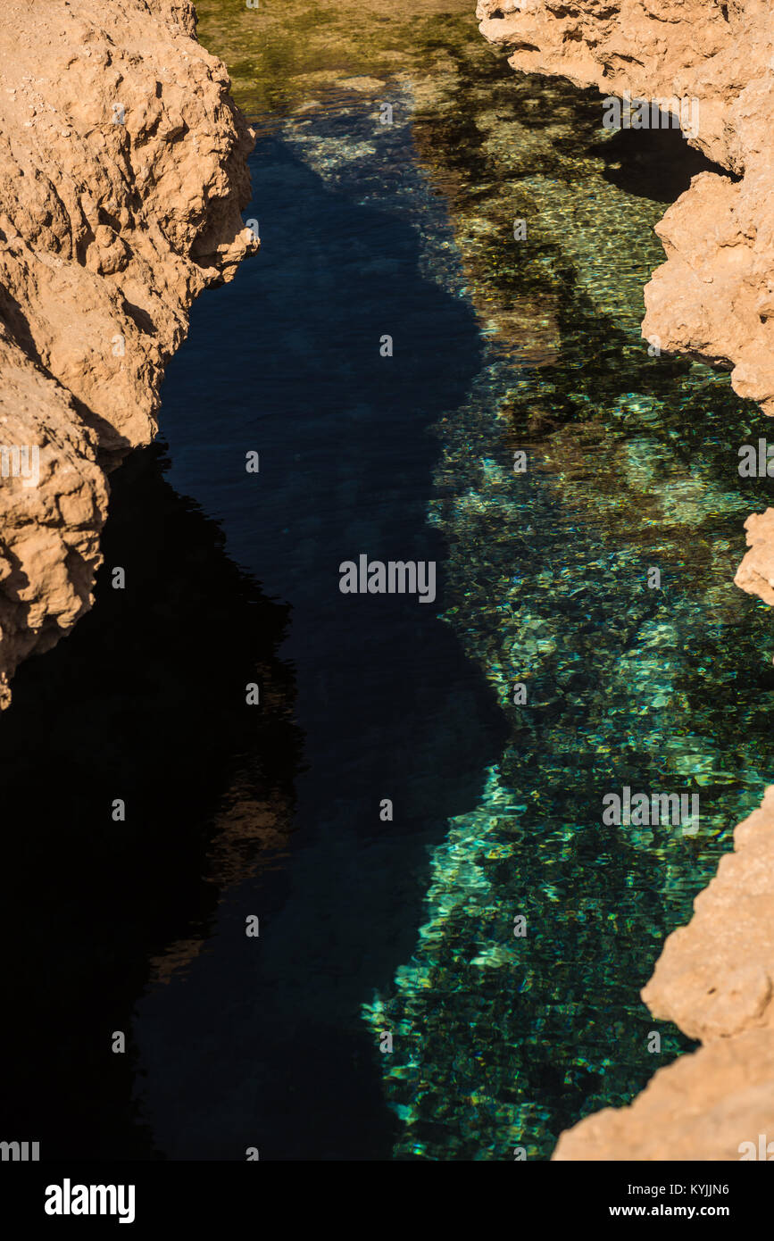 A crack in the ground. A rift in the earth full of clean sea water ...