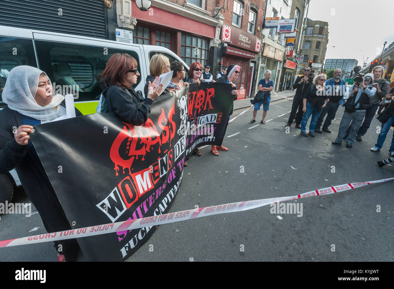 Protesters, including local residents, posed for photographs with ...