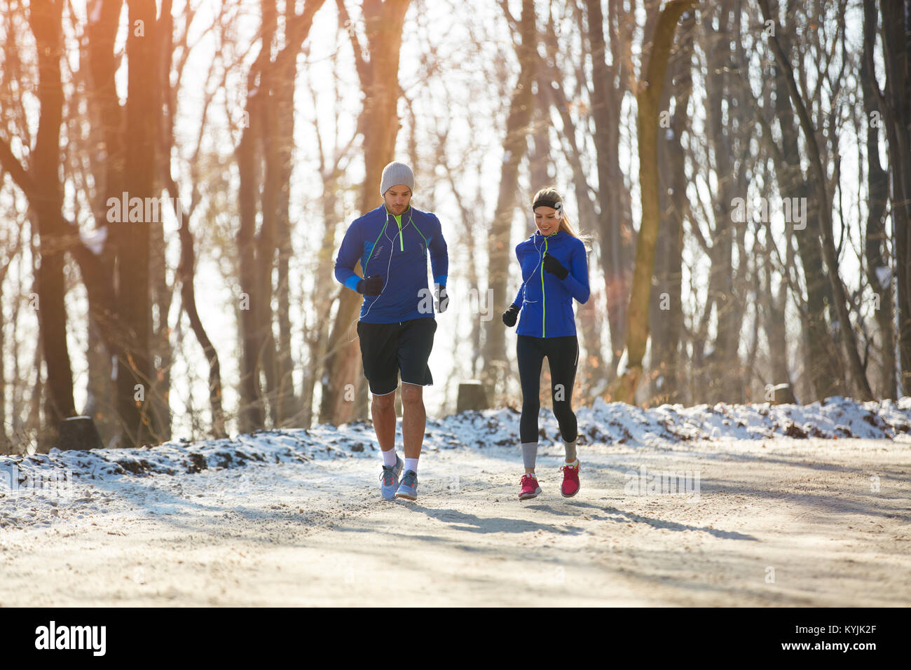 Couple running forest hi-res stock photography and images - Alamy
