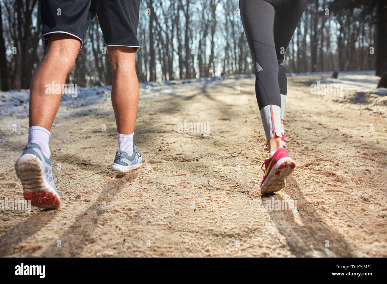 Close up of couples leg, back view, while walking in nature - concept ...