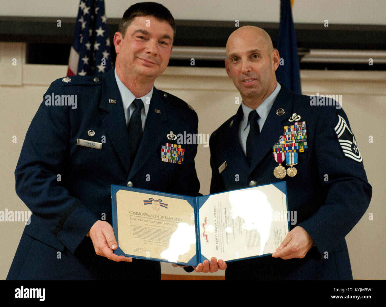 Chief Master Sgt. Steven Peters (right) is presented with a Kentucky ...