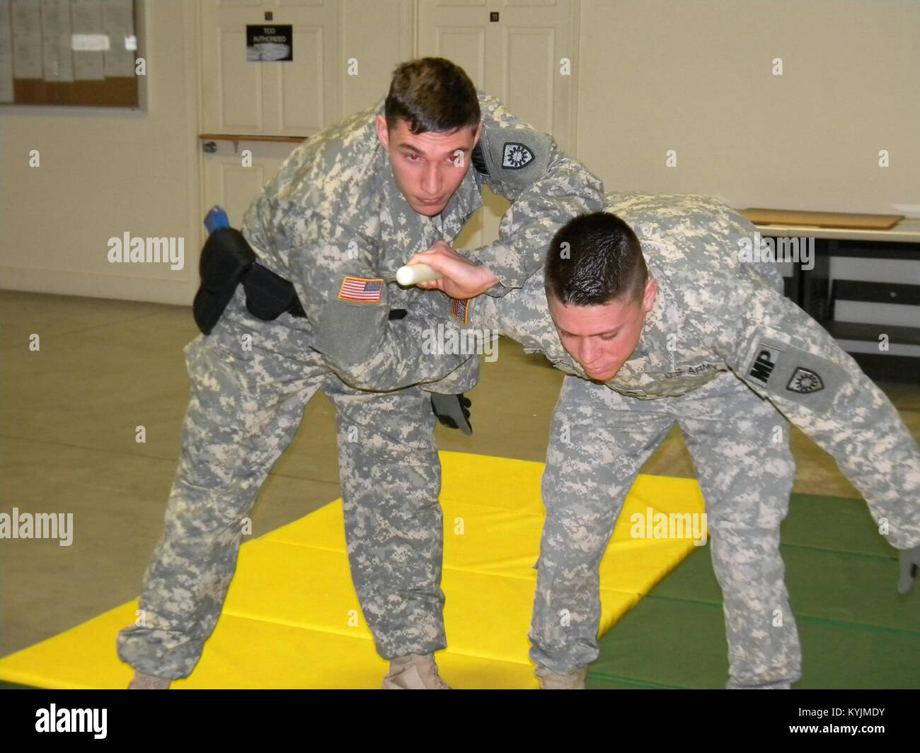 Spc. Aaron Lunn (left) performs a Mechanical Advantage Control Hold ...