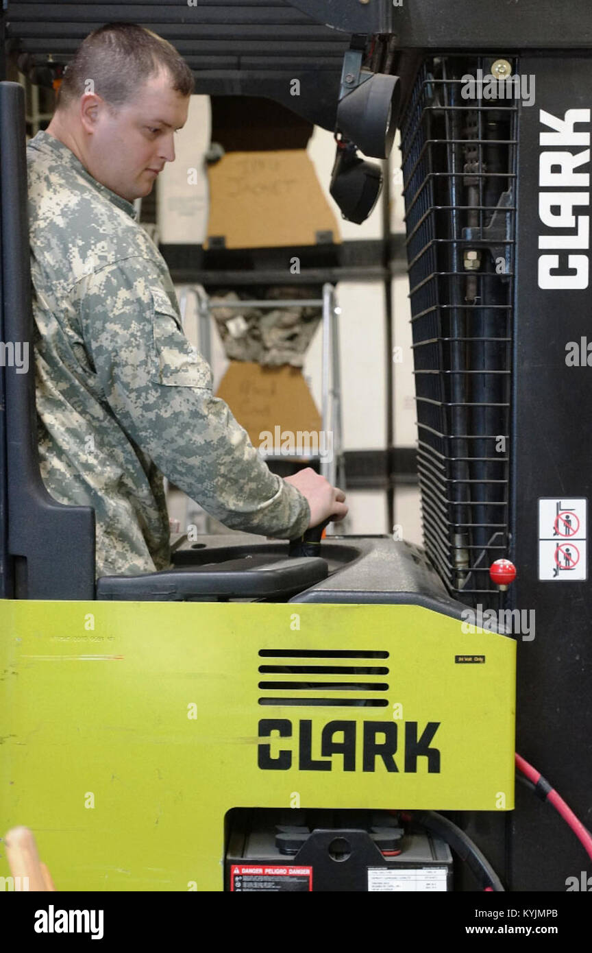 Sgt. Johnny Johnson of Harrodsburg, Ky. drives a forklift while moving ...