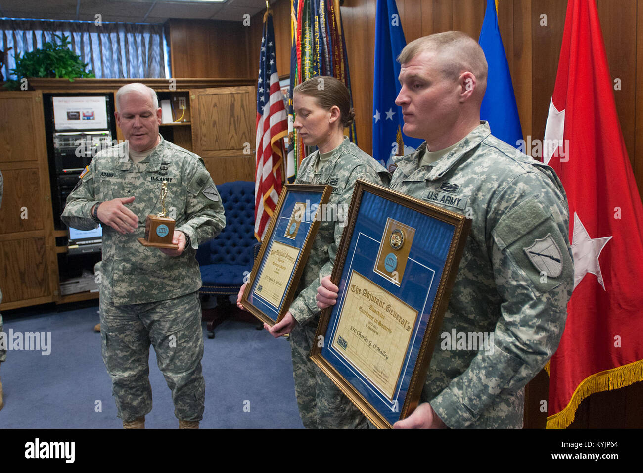 Brig. Gen. Benjamin Adams III presents the Adjutant General's Award for ...