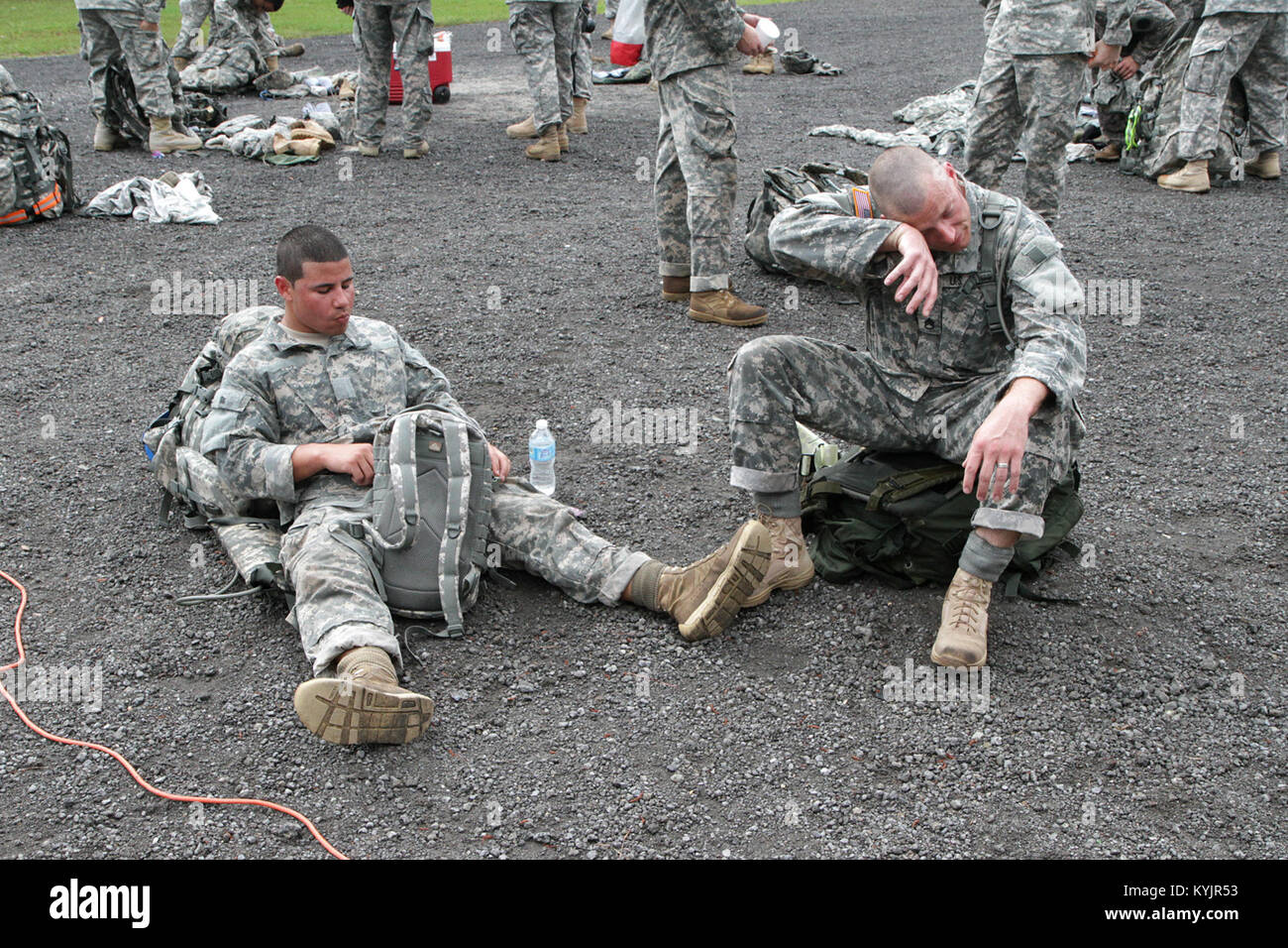 Sgt. Christopher DeLeon (left) and Staff Sgt. Nicholas Anglin rest ...