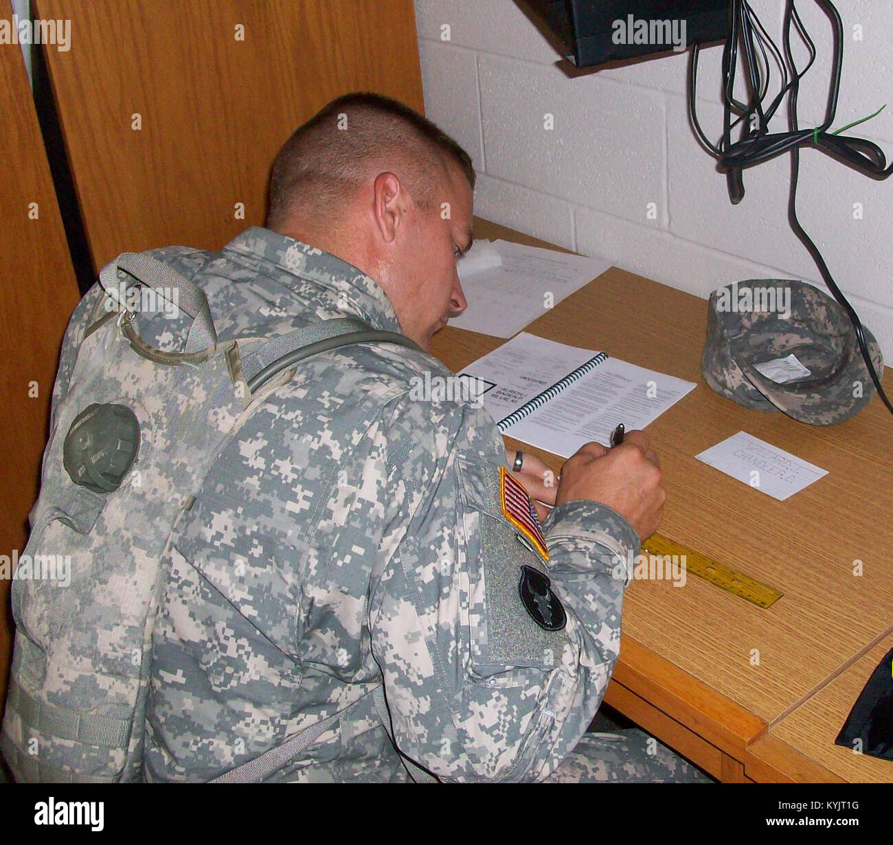 U.S. Army National Guard soldier doing paperwork at desk Stock Photo ...