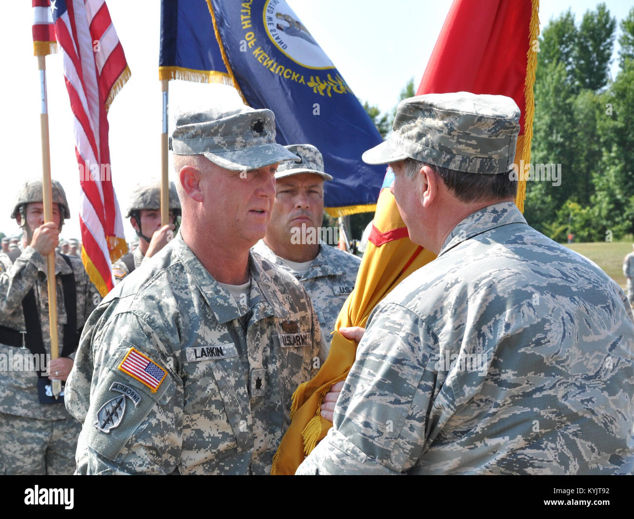 Lt. Col. Rob Larkin receives the colors from Maj. Gen. Edward W. Tonini ...