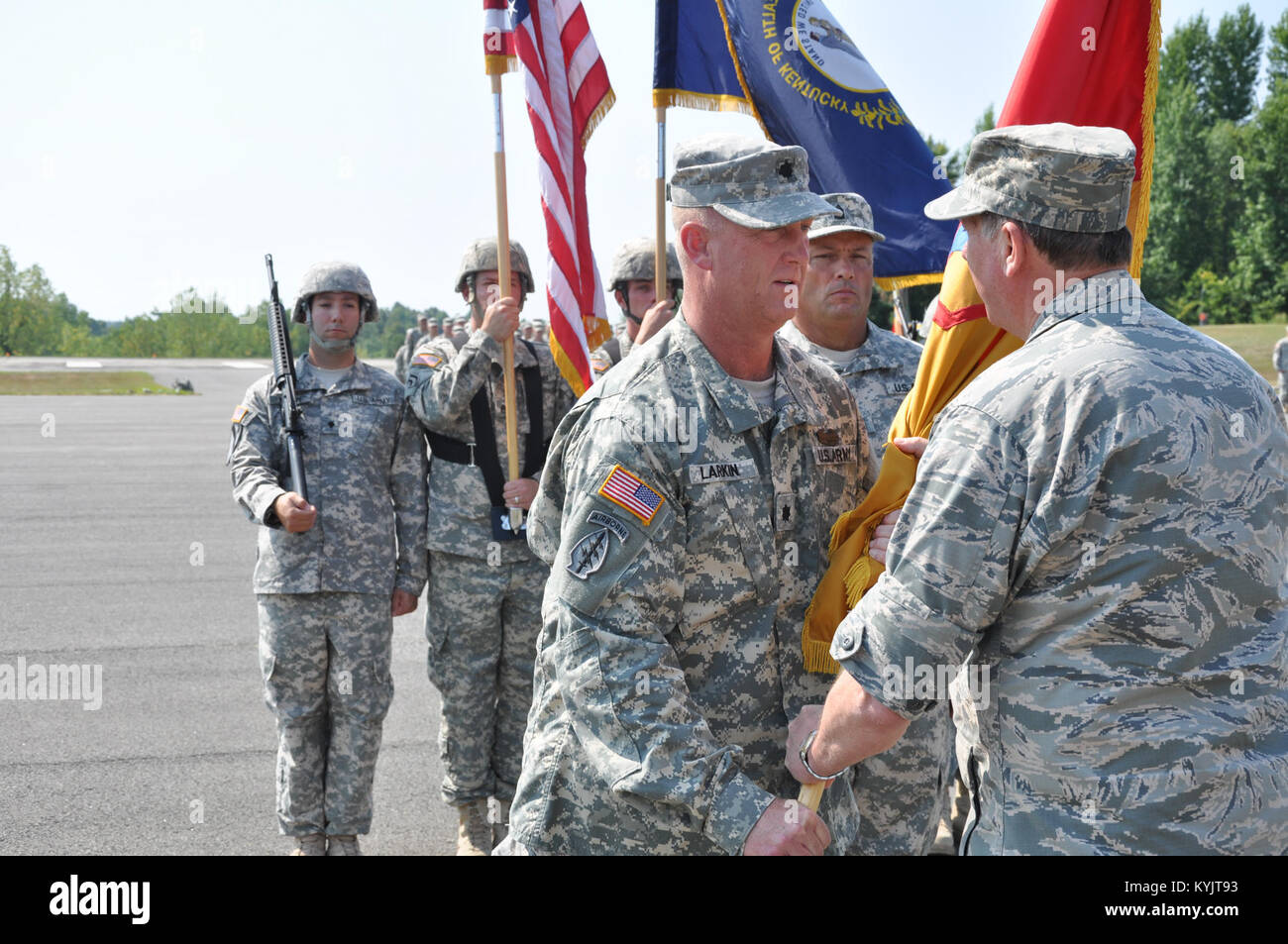 Lt. Col. Rob Larkin receives the colors from Maj. Gen. Edward W. Tonini ...