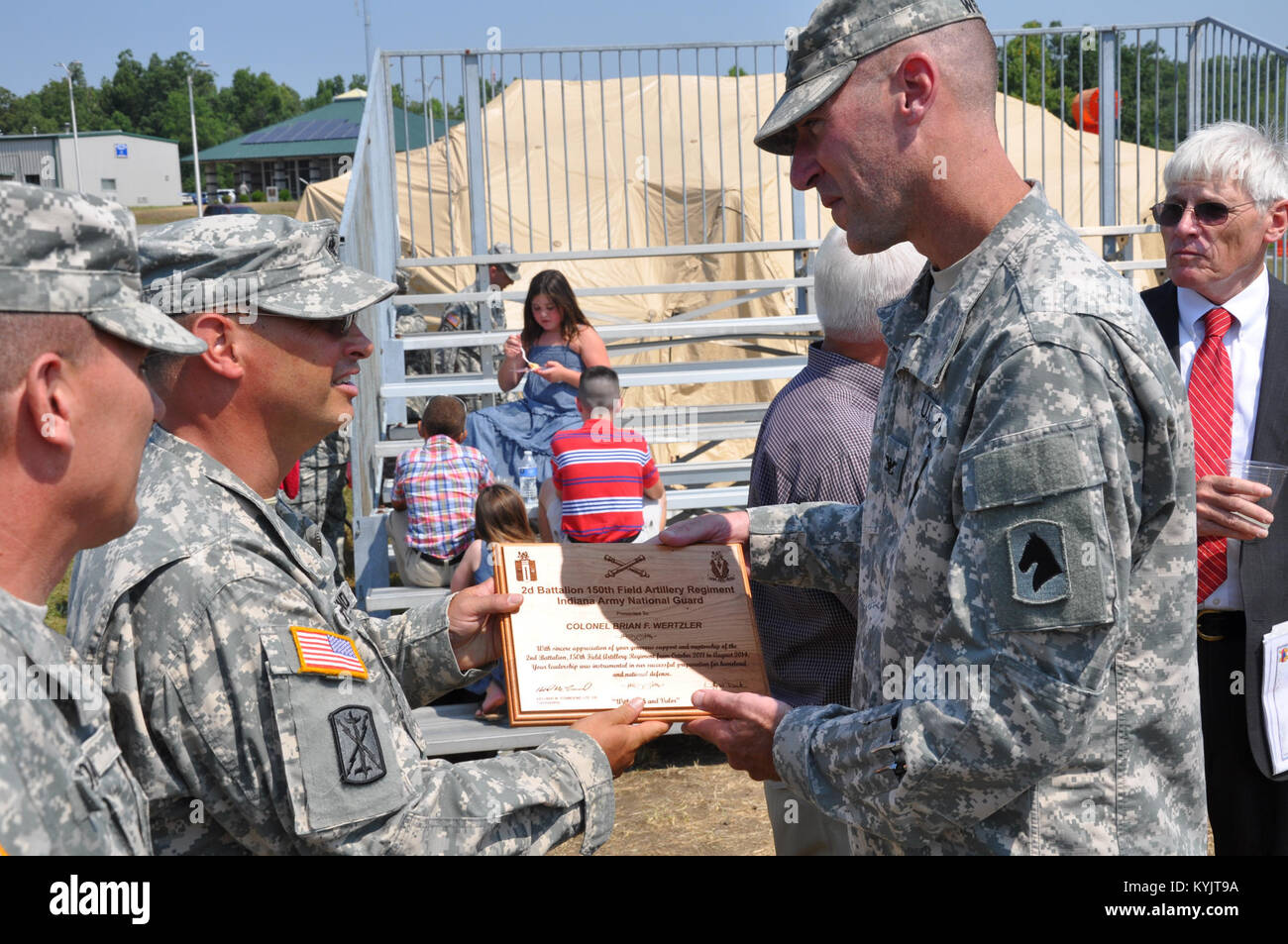 The Indiana Army National Guard presents a plaque to outgoing commander ...