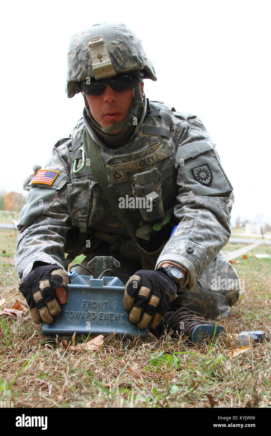 Pfc. Matthew Clay with the 577th Sapper Company places a M18A1 Claymore ...