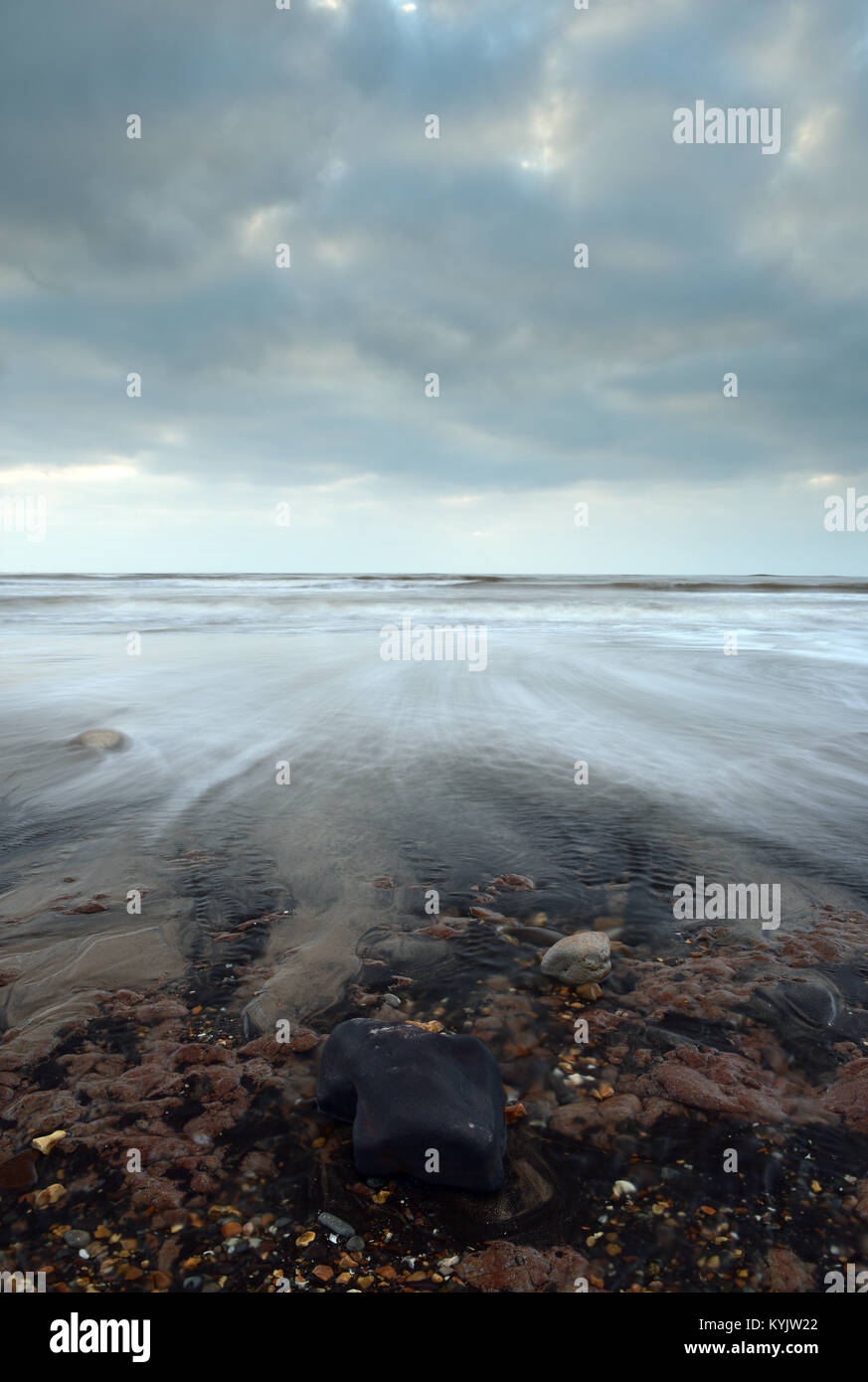A beautiful and atmospheric seascape on the Isle of Wight with waves ...