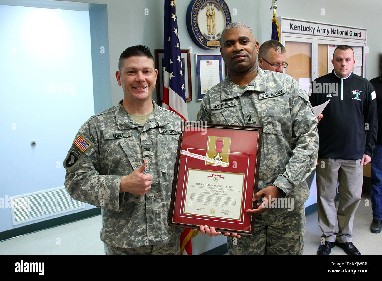 Col. Michael Abell presents Sgt. Maj. Thomas Johnson with the Legion of ...
