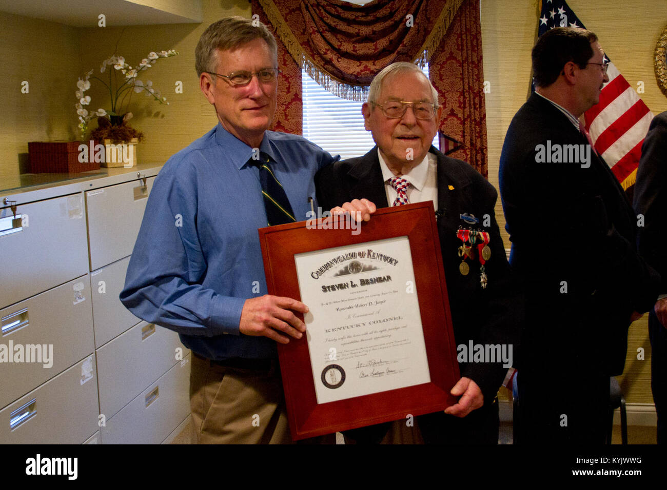 Col. (R) Tom Turning presents a Kentucky Colonel certificate to Hubert ...