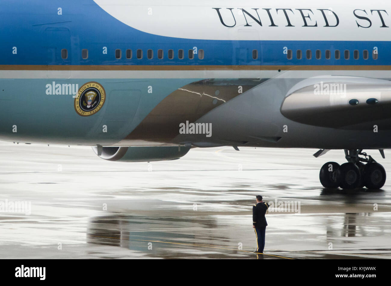 A U.S. Army Soldier salutes Air Force One April 2, 2015, as it arrives ...