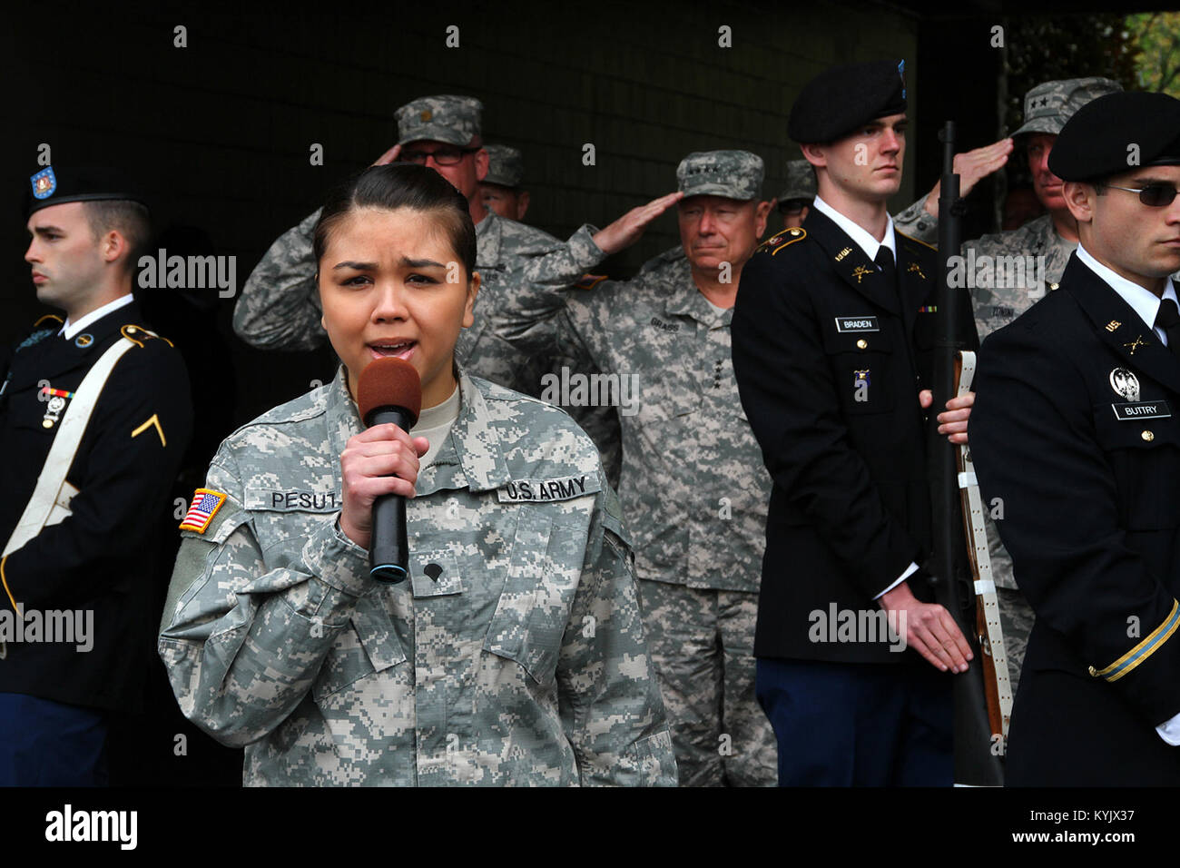 Spc. Stacy Pesut sings the National Anthem during Military Appreciation ...