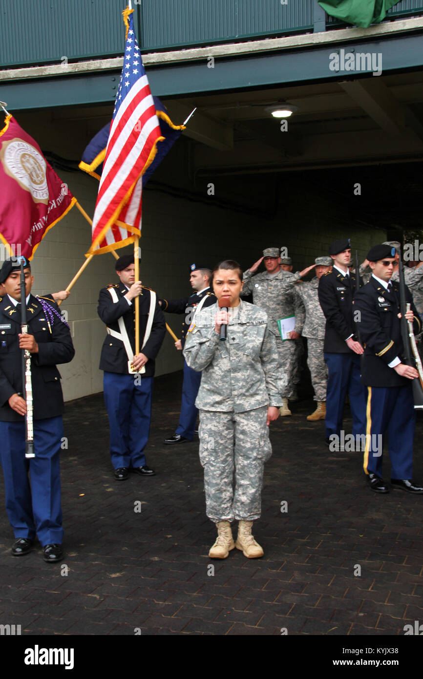 Spc. Stacy Pesut sings the National Anthem during Military Appreciation ...