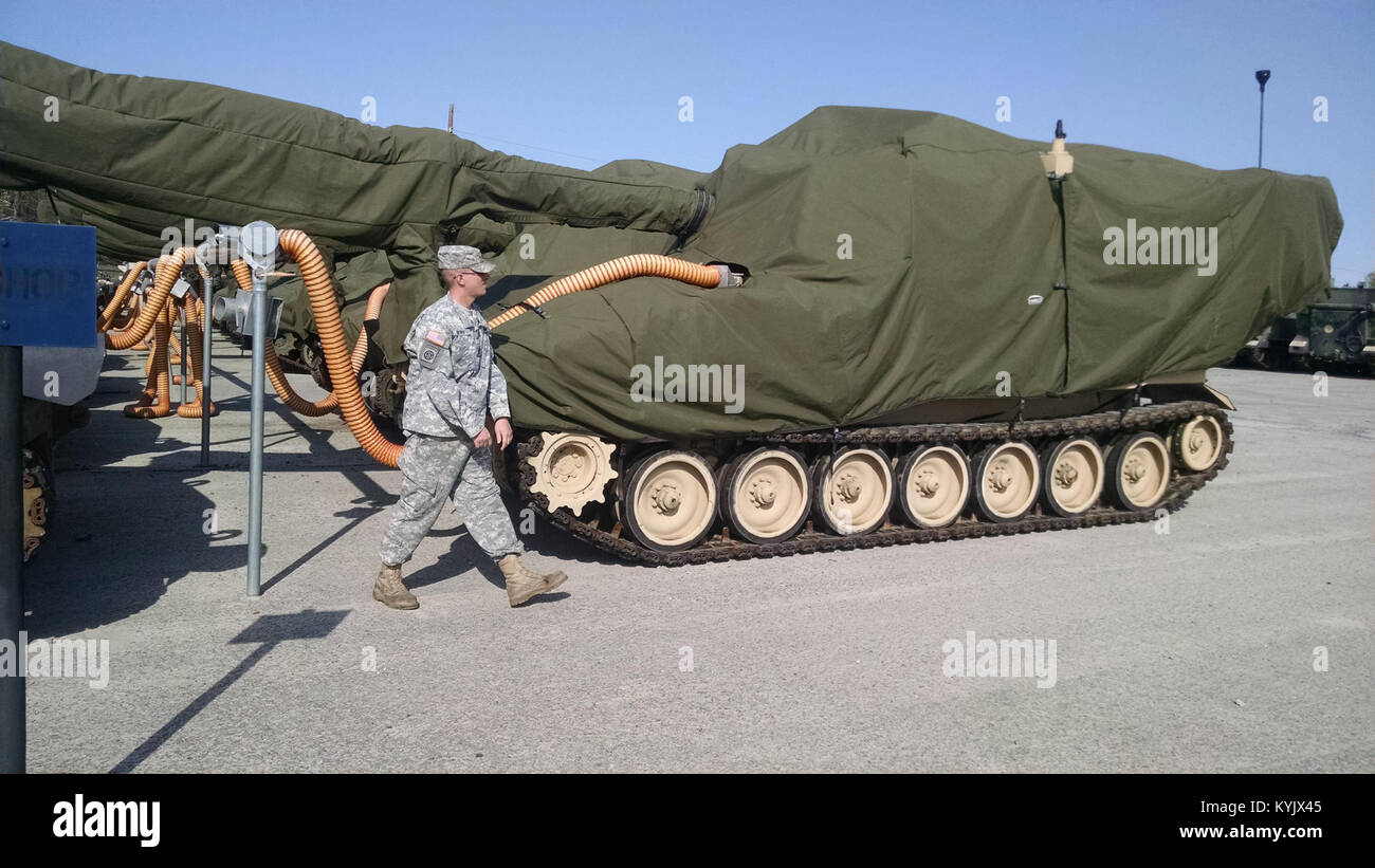 Staff Sgt. Eric Miers checks the controlled humidity protection hose ...