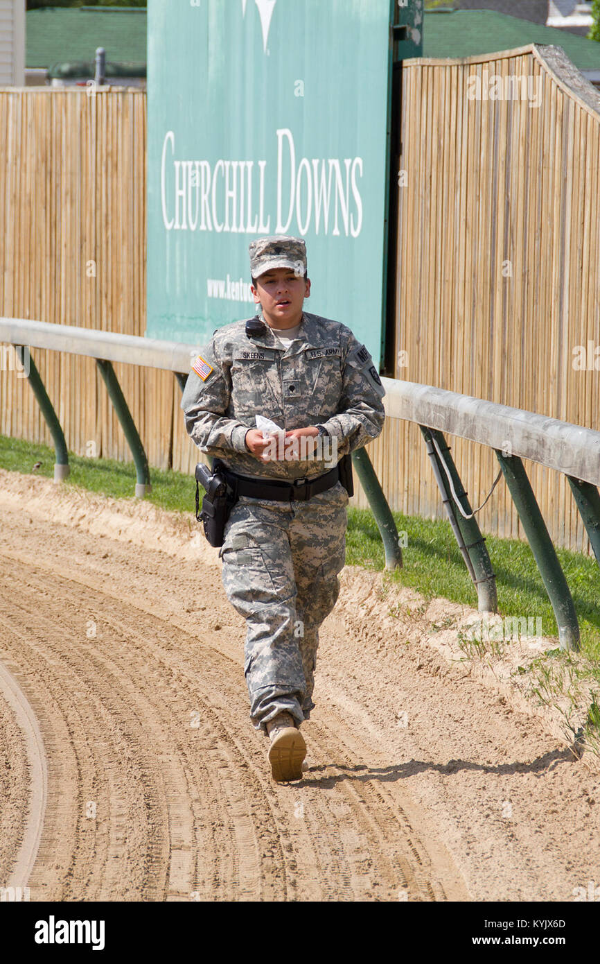 Spc. Skeens with the 198th Military Police Battalion retrieves debris ...