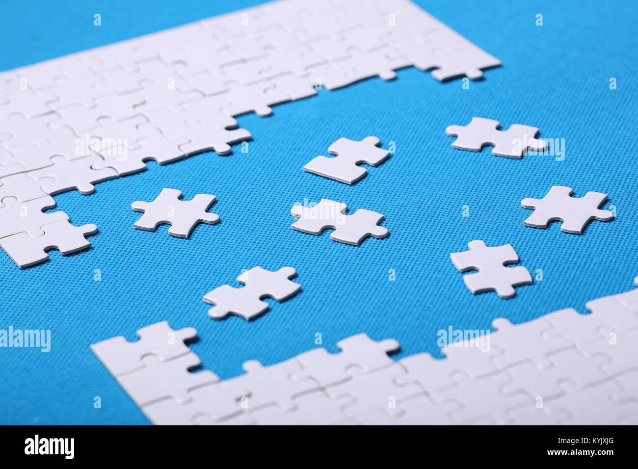 White details of a puzzle on a blue background. A puzzle is a pu Stock ...