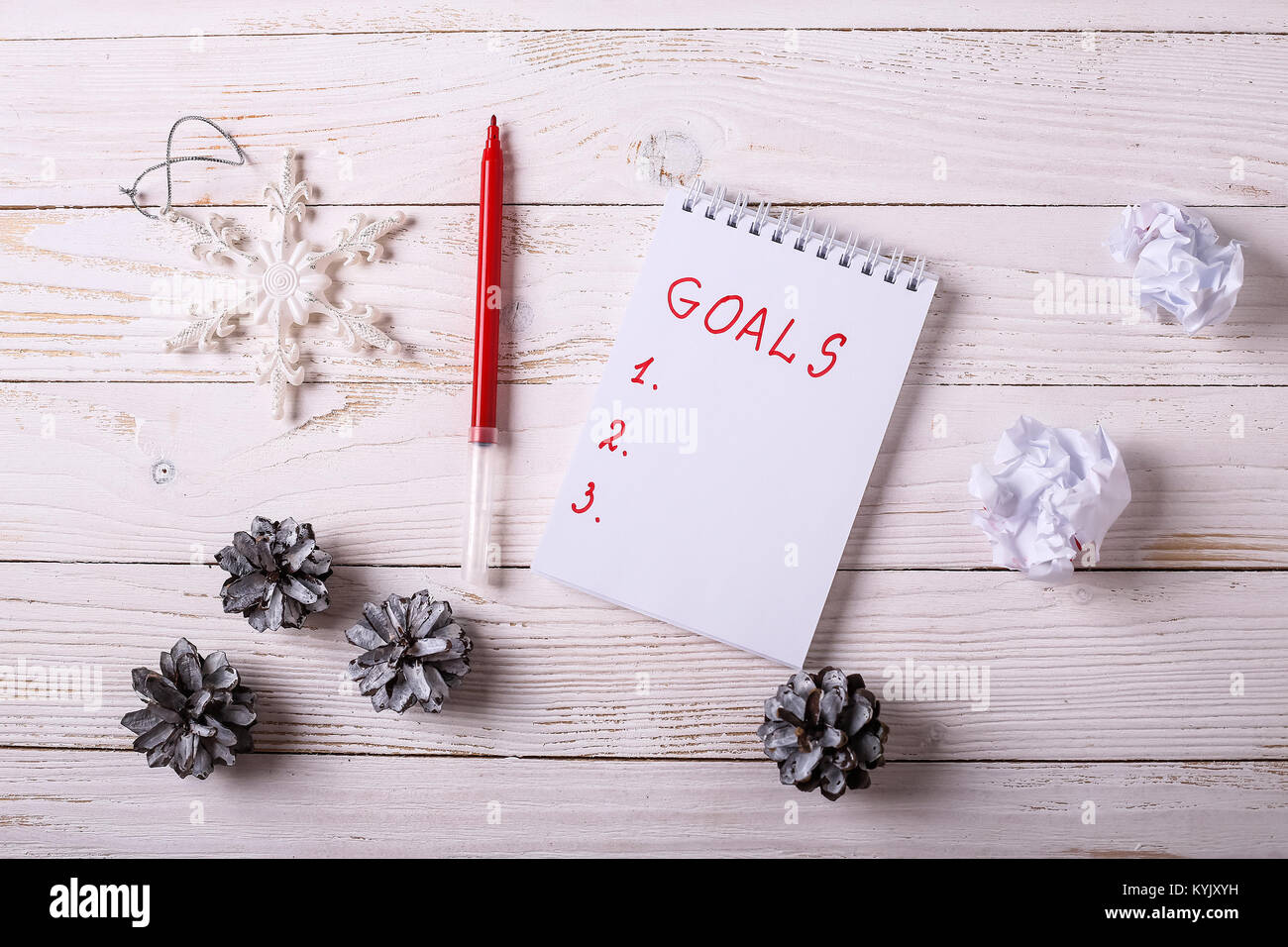 Workplace with a diary, decorations and gifts. New Year's list o Stock ...