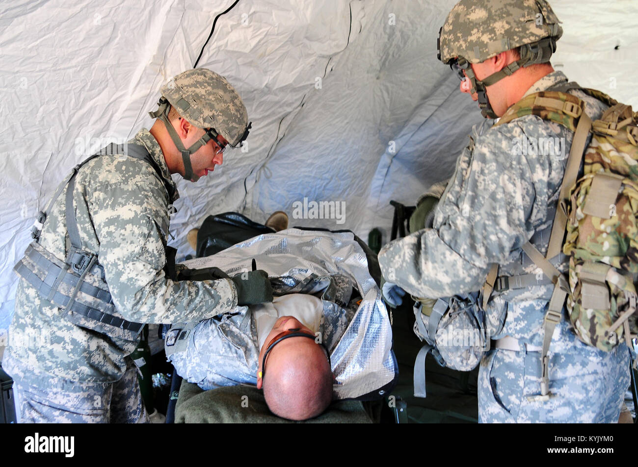 Sgt. Orlando Gonzalez finishes his triage of a simulated casualty and ...