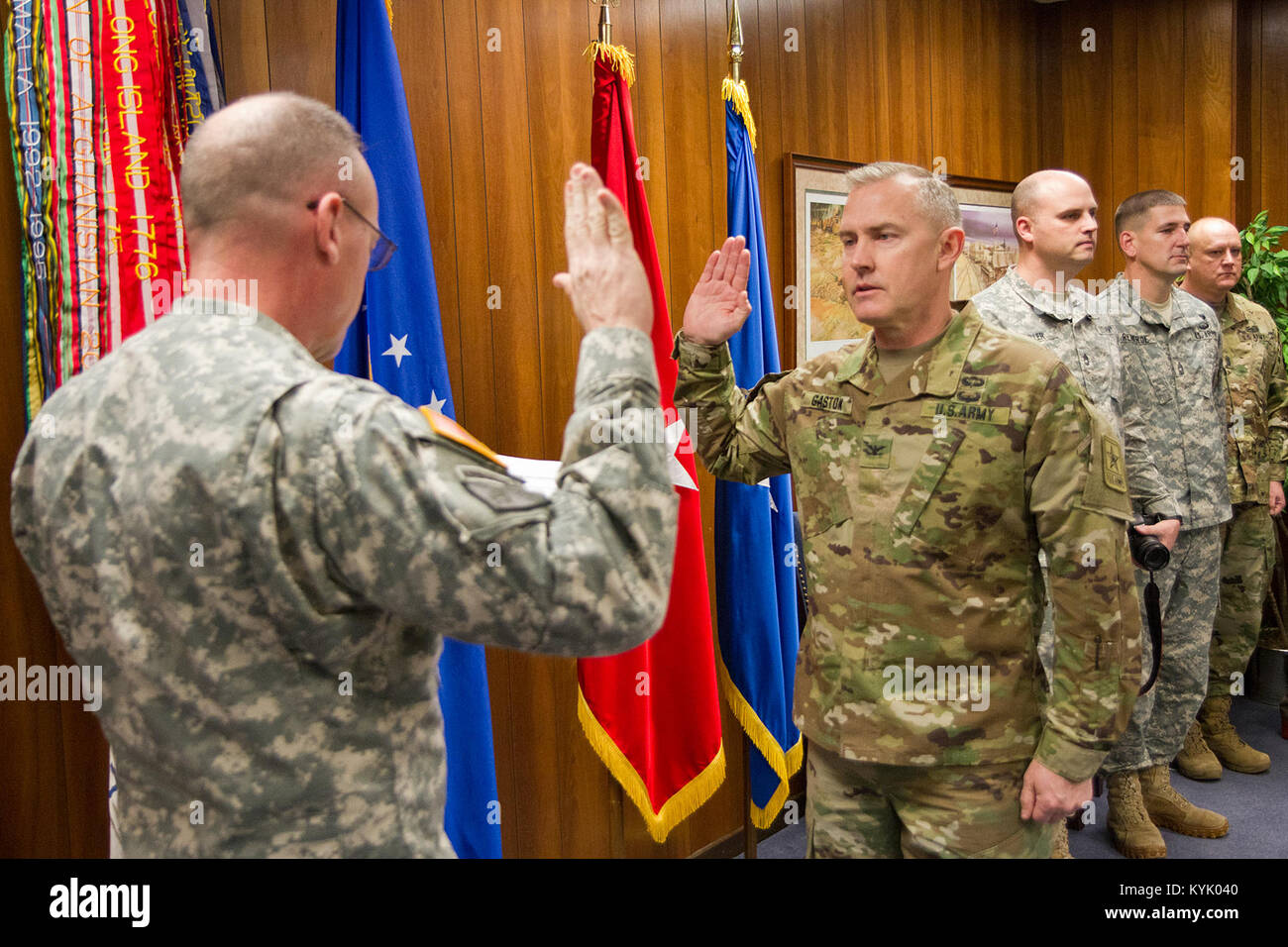 Brig. Gen. Stephen R. Hogan swears in Col. Thomas Gaston Jr. during a ...