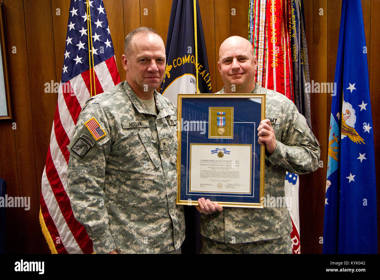 Brig. Gen. Stephen R. Hogan presents Lt. Col. Billy Siekman with the ...