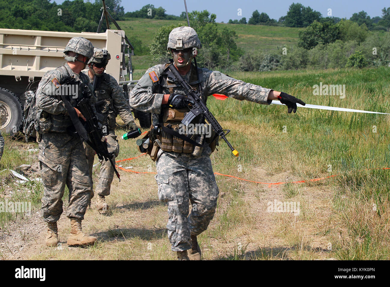 Soldiers with the 1123rd Sapper Company advance to breach an obstacle ...