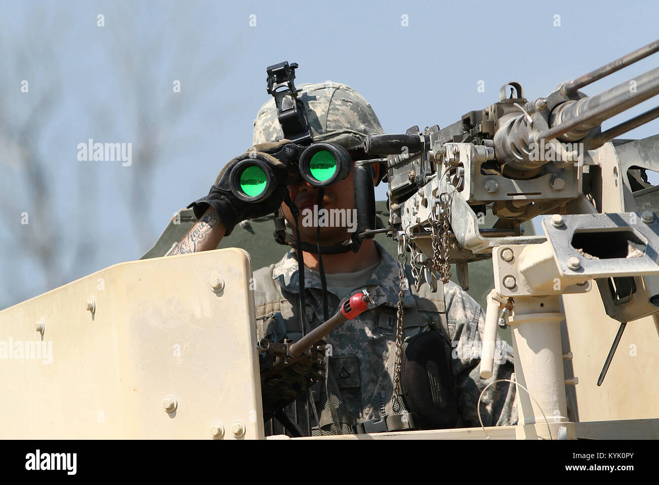 A Soldier with the 1123rd Sapper Company scans for opposition forces ...