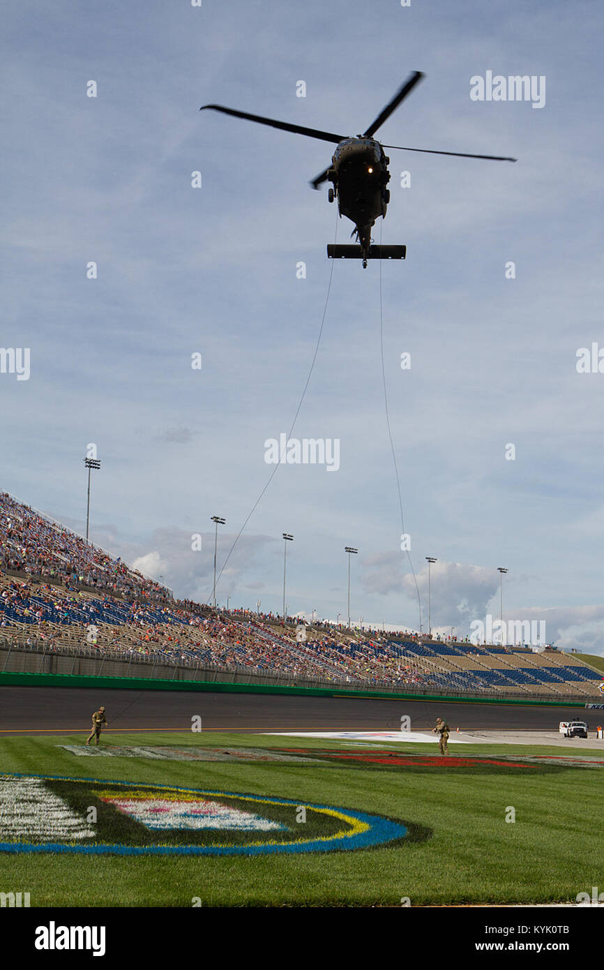 Members of the 123rd Special Tactics Squadron repel from a UH-60 ...