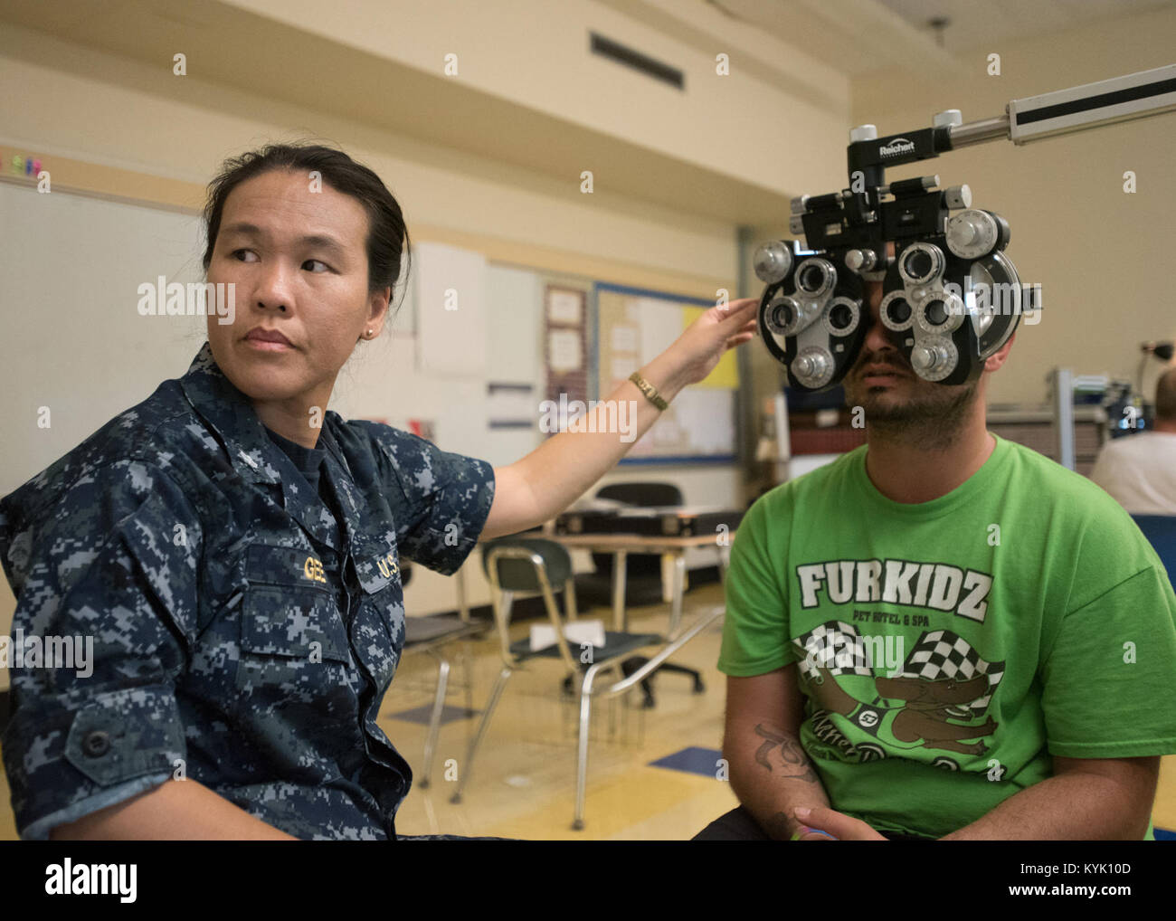 U.S. Navy Cmdr. Sharlene Gee, an optometrist with Expeditionary Medical ...