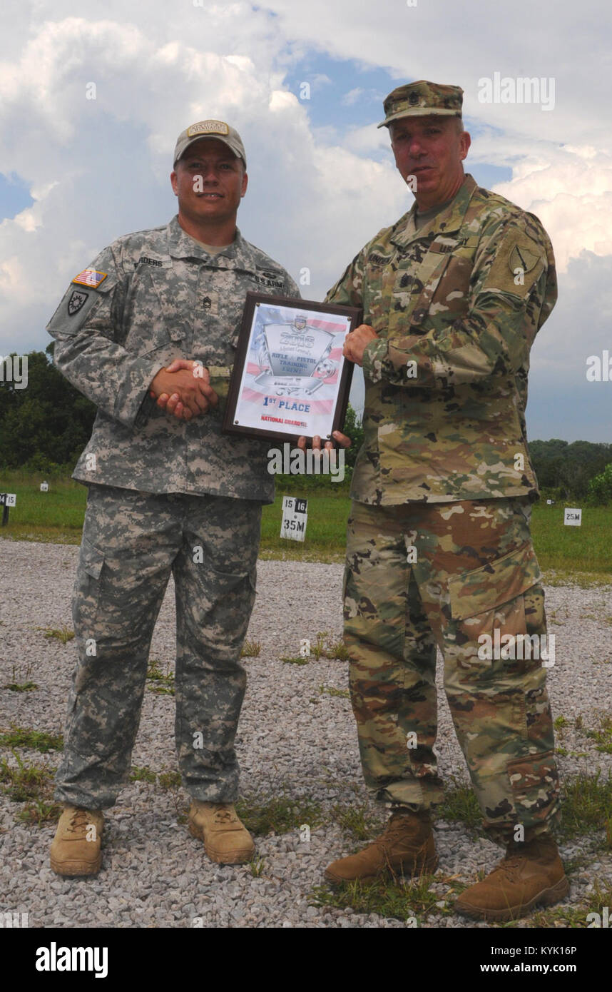 Army Sgt. 1st Class Kevin Borders accepts the individual 1st Place ...