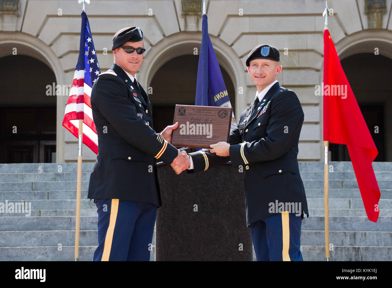 Maj. Corey Flannery presents 2nd Lt. Cody Stagner with the physical ...