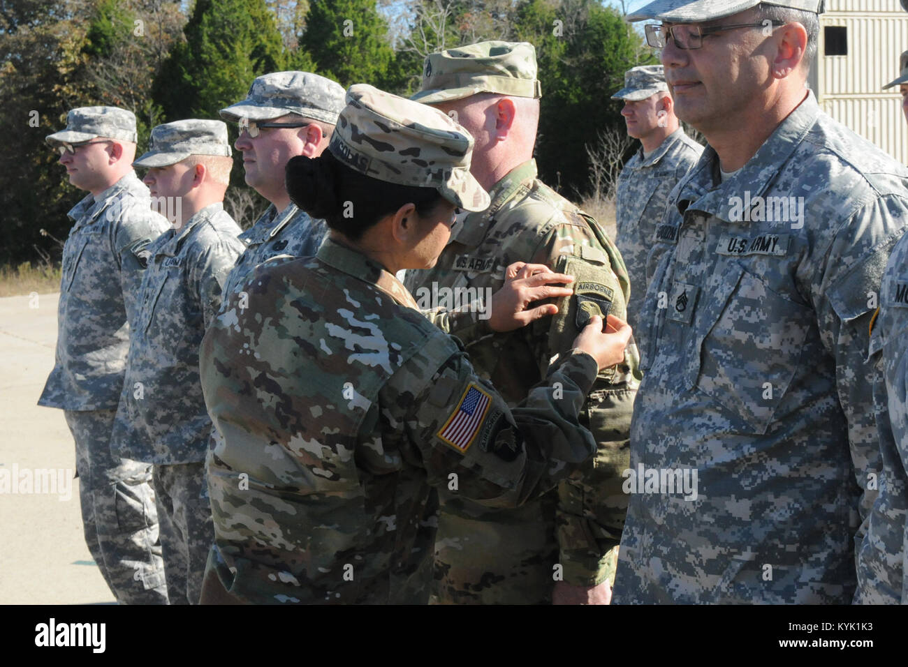 Lt. Col. Gina SanNicolas places the 101st Airborne Division patch on of ...