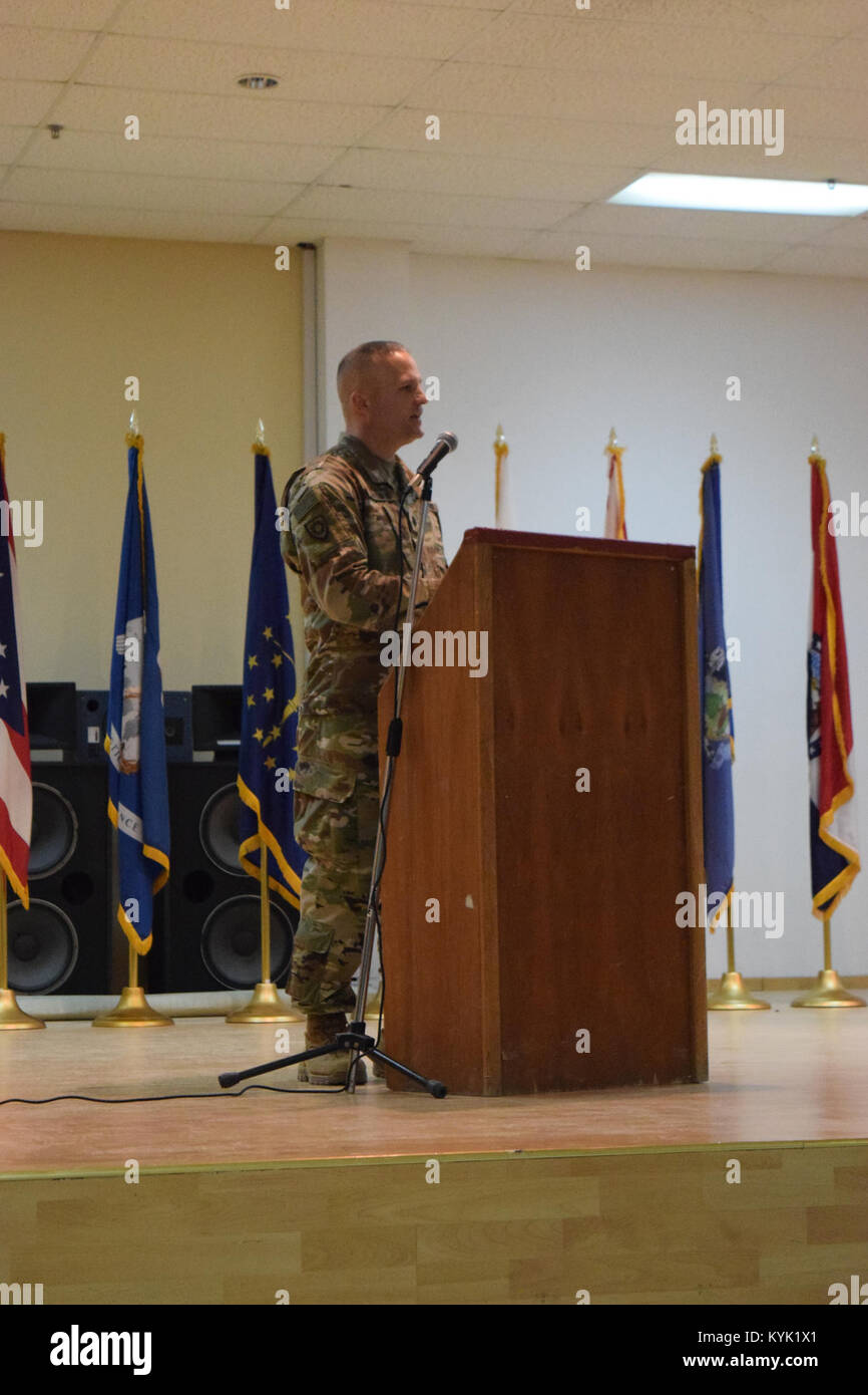 Lt. Col. Joseph Gardner (right), commander of the 149th MET, gives ...