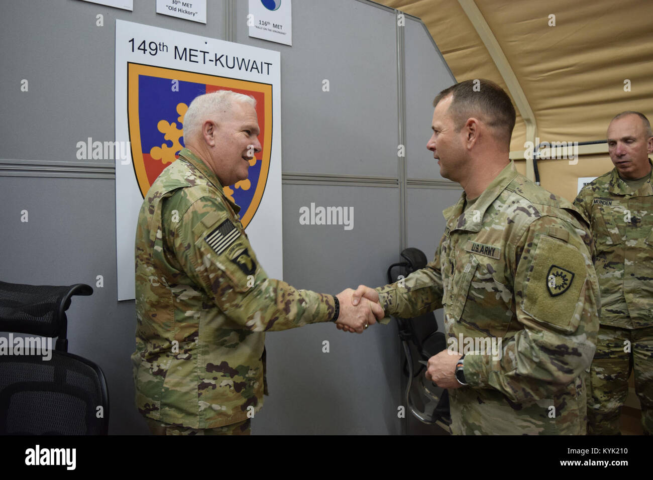 Command Sgt. Maj. Jesse Withers, right, presents Brig. Gen. Benjamin ...