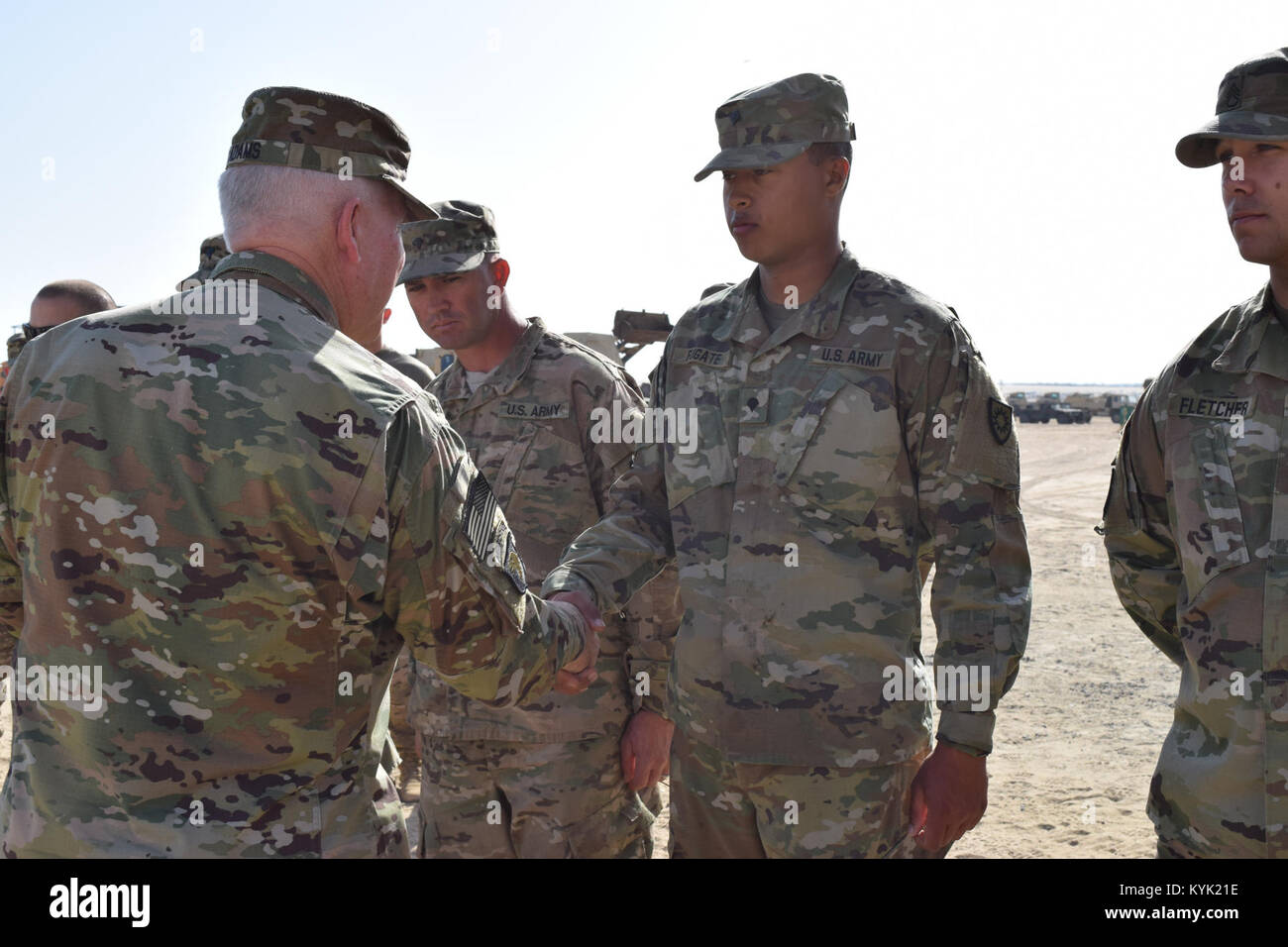 Spc. Alec Fugate with the 207th Horizontal Constuction company receives ...